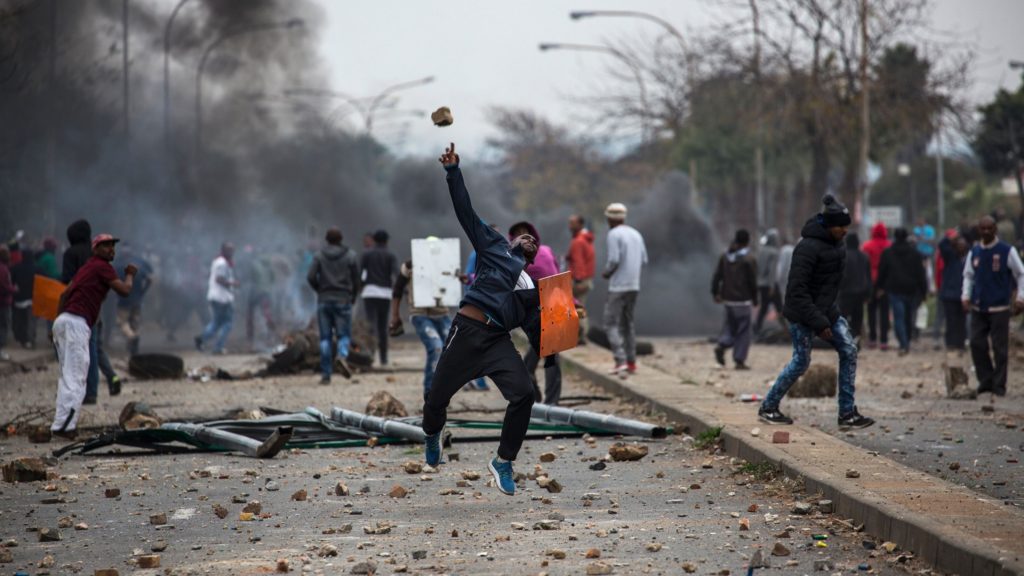 Wesizwe warns of "huge losses" after protests force suspension of ...